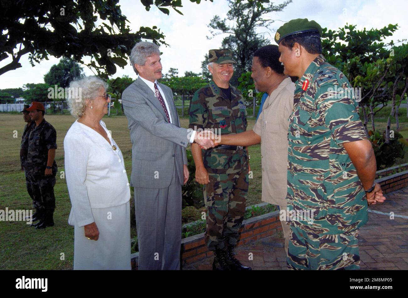 Charge d' Affairs, Mr. Hugh Simon greets Guyana President Samuel A. A ...