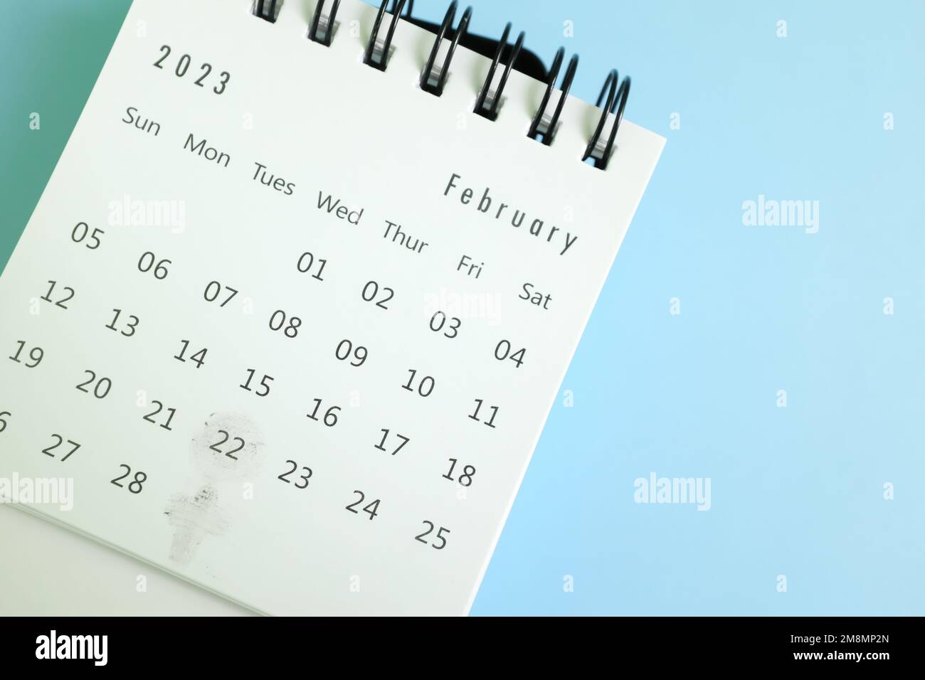 Selective focus of desk calendar with marked February 22 2023. Ash ...