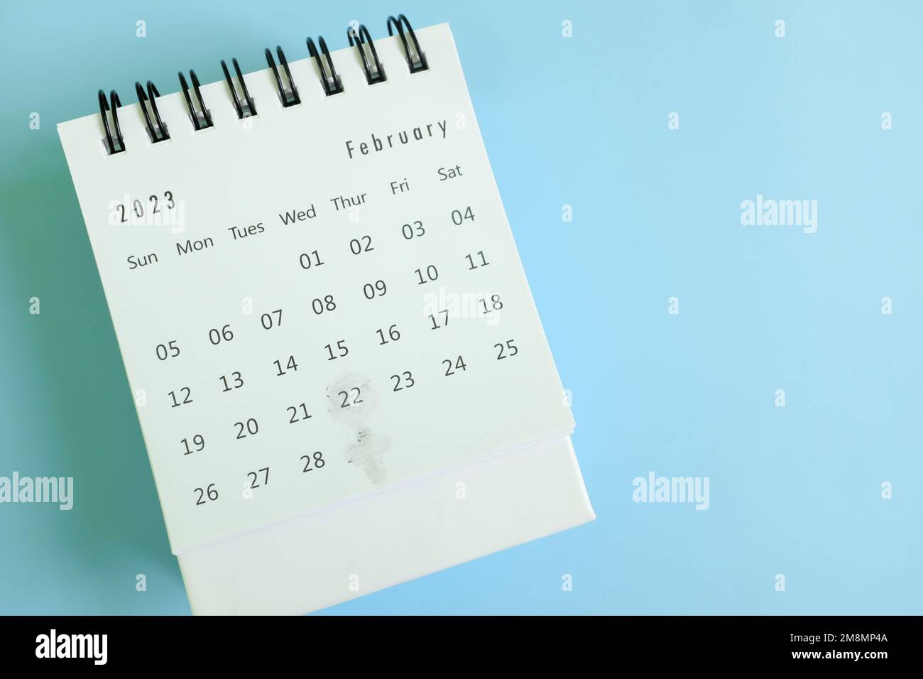 Selective focus of desk calendar with marked February 22 2023. Ash ...