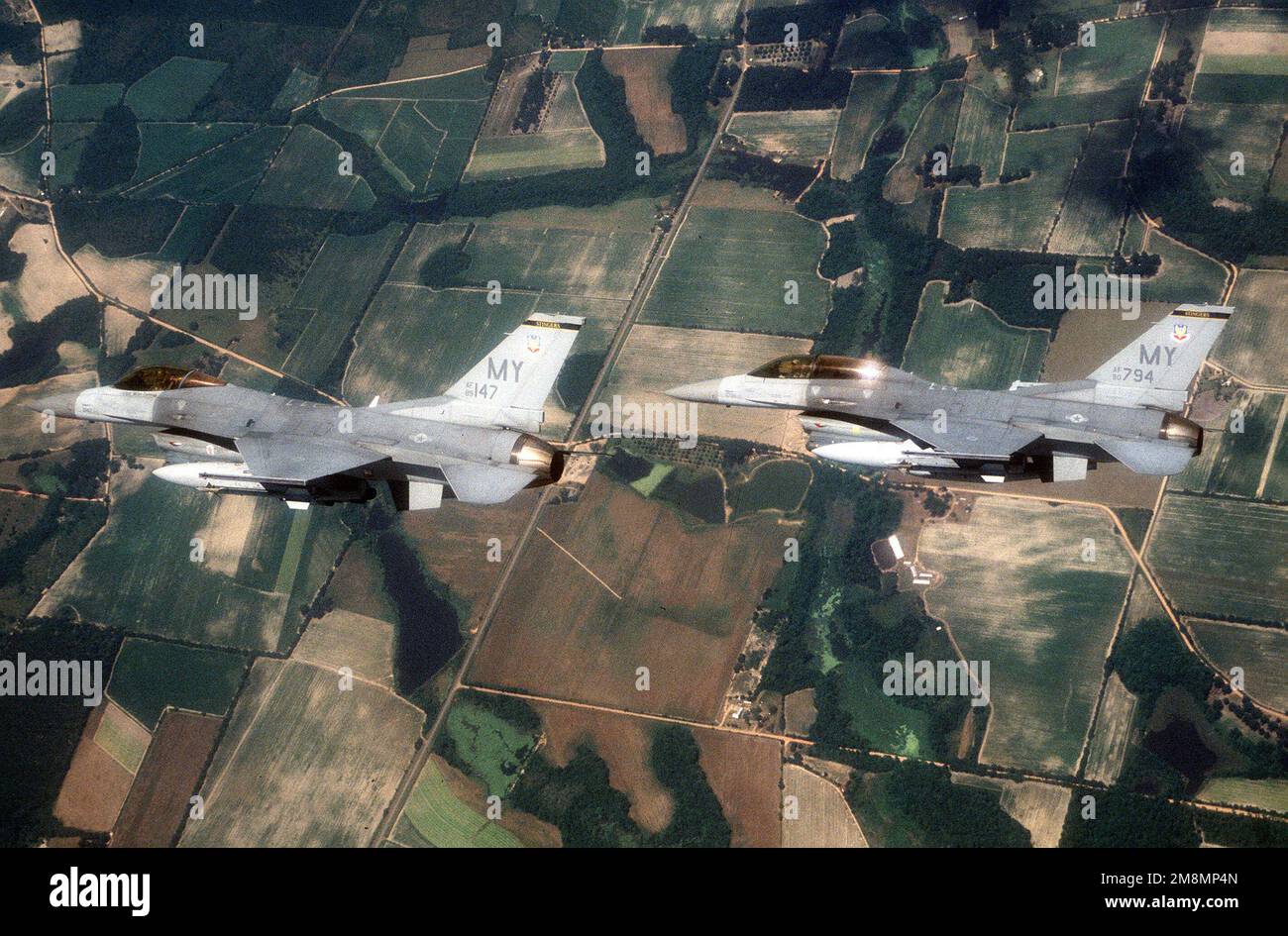 Two F-16 Falcon aircraft push toward the bombing range. Subject ...