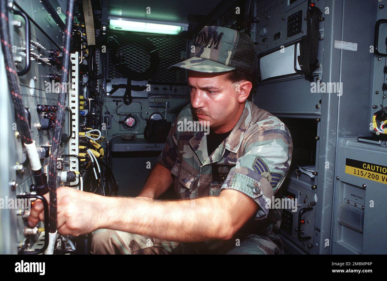 A maintenance person from the 69th Fighter Squadron works on the F-16C ...