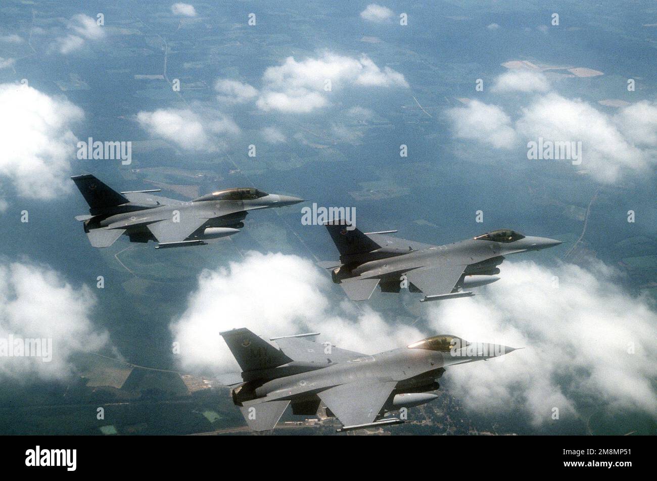 Three F-16 Falcon aircraft from the 347th Composite Wing/69th Fighter ...