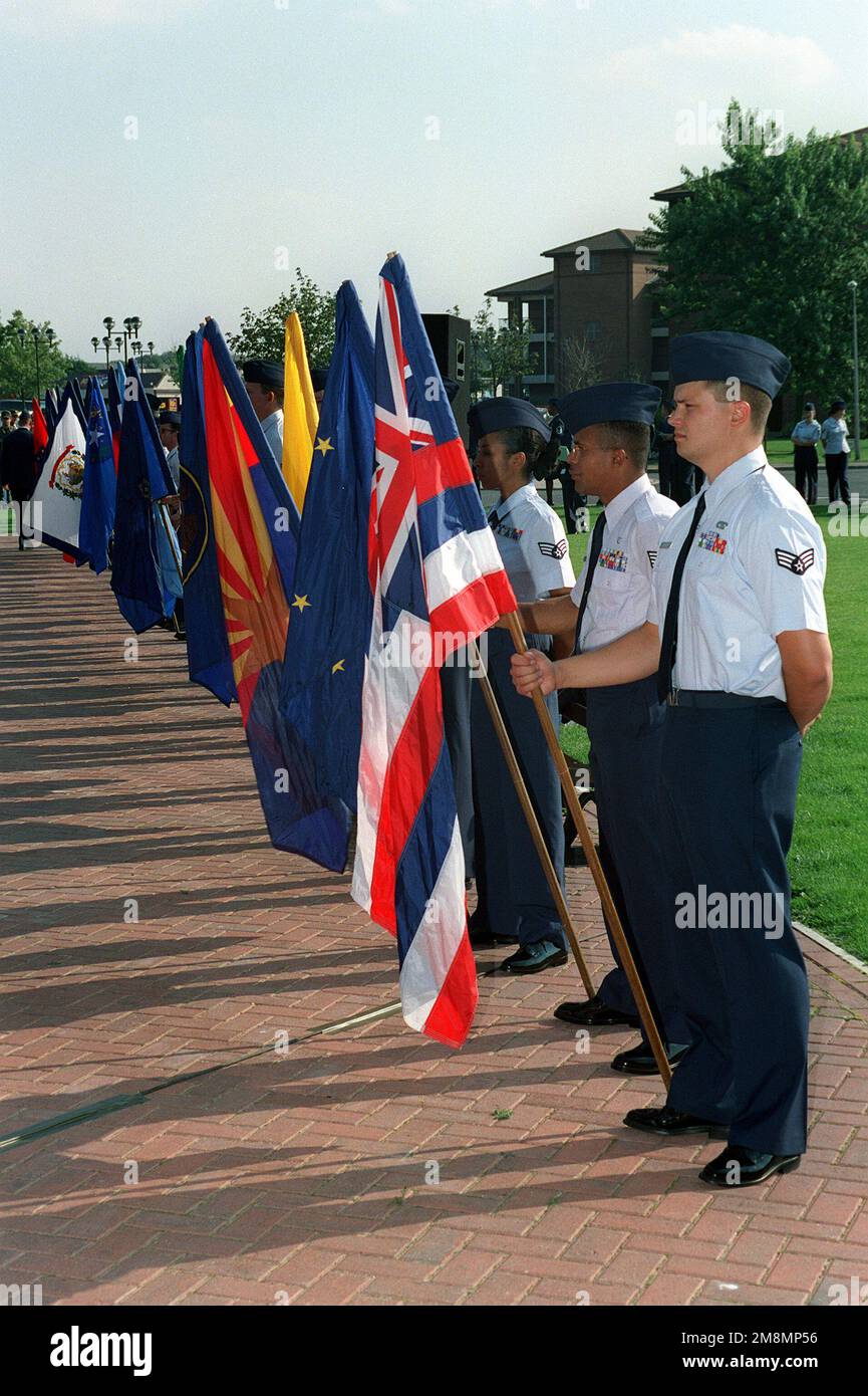 U.S. Air Force airmen display state flags along the walkway of the ...