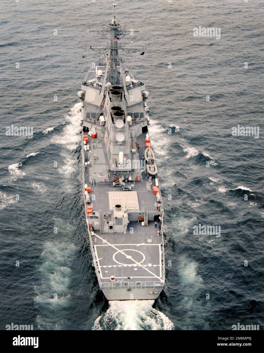 High oblique aerial stern-on view of the guided missile destroyer USS ...