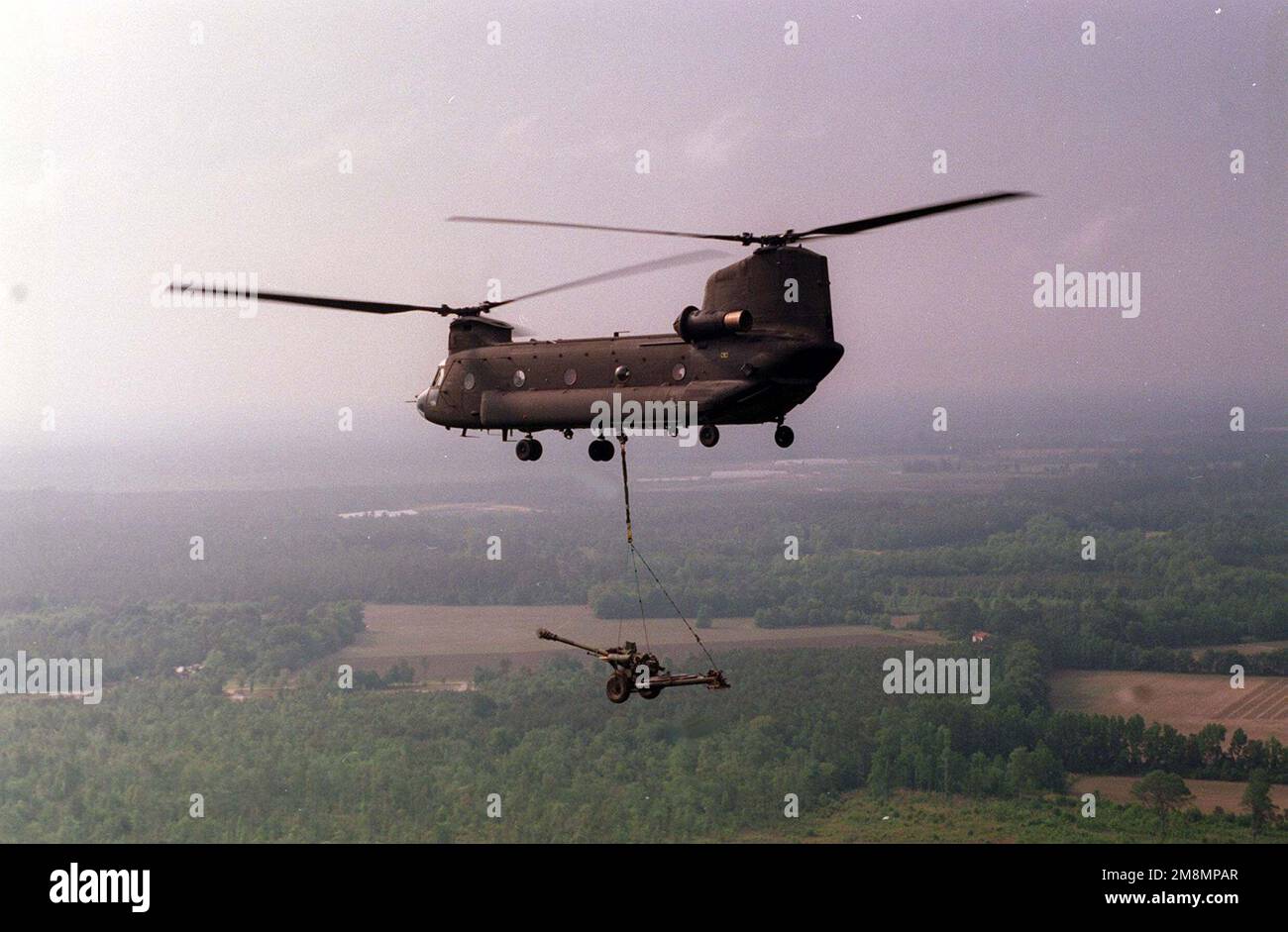 960516-M-0826D-002 A British 105mm Howitzer is externally lifted to ...