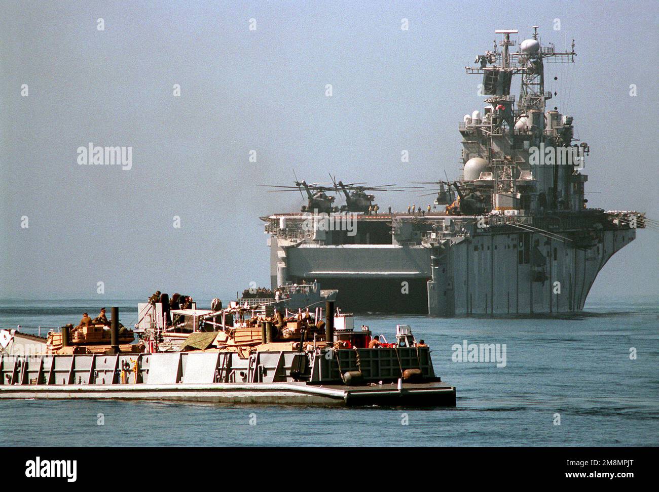 Two Landing Craft Utility (LCU), loaded with Light Armored Vehicle's ...