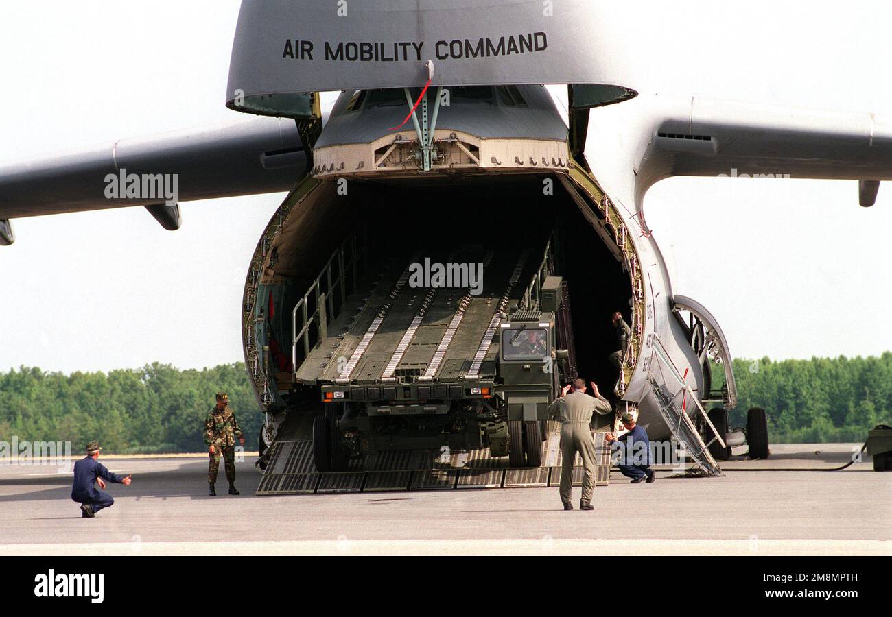 The new 60K Tunner Loader is marshaled off of a C-5 Galaxy marking the ...