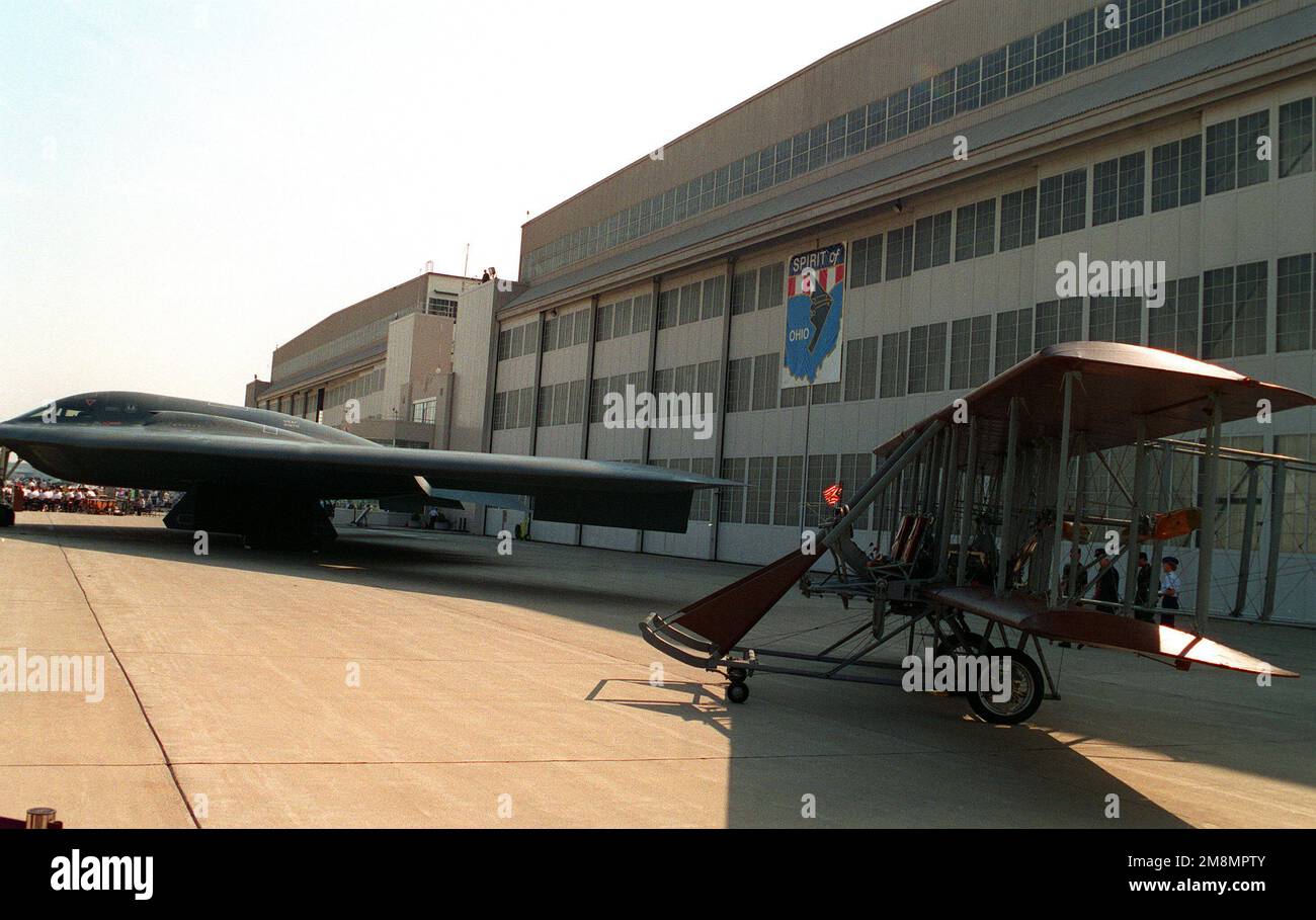 The B-2 "Spirit of Ohio" stealth bomber sits next to the Wright Flyer ...