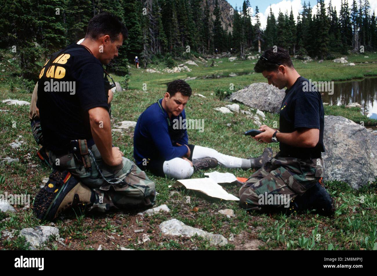 MSGT Eric Wass (right), an Explosive Ordnance Disposal member, confirms ...