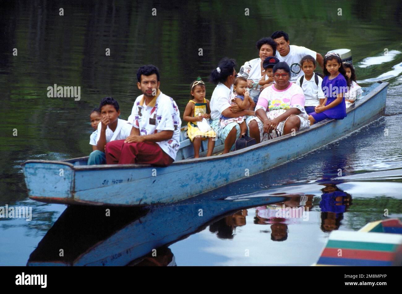 Local residents of Malali, who are seeking medical care arrive by boat ...