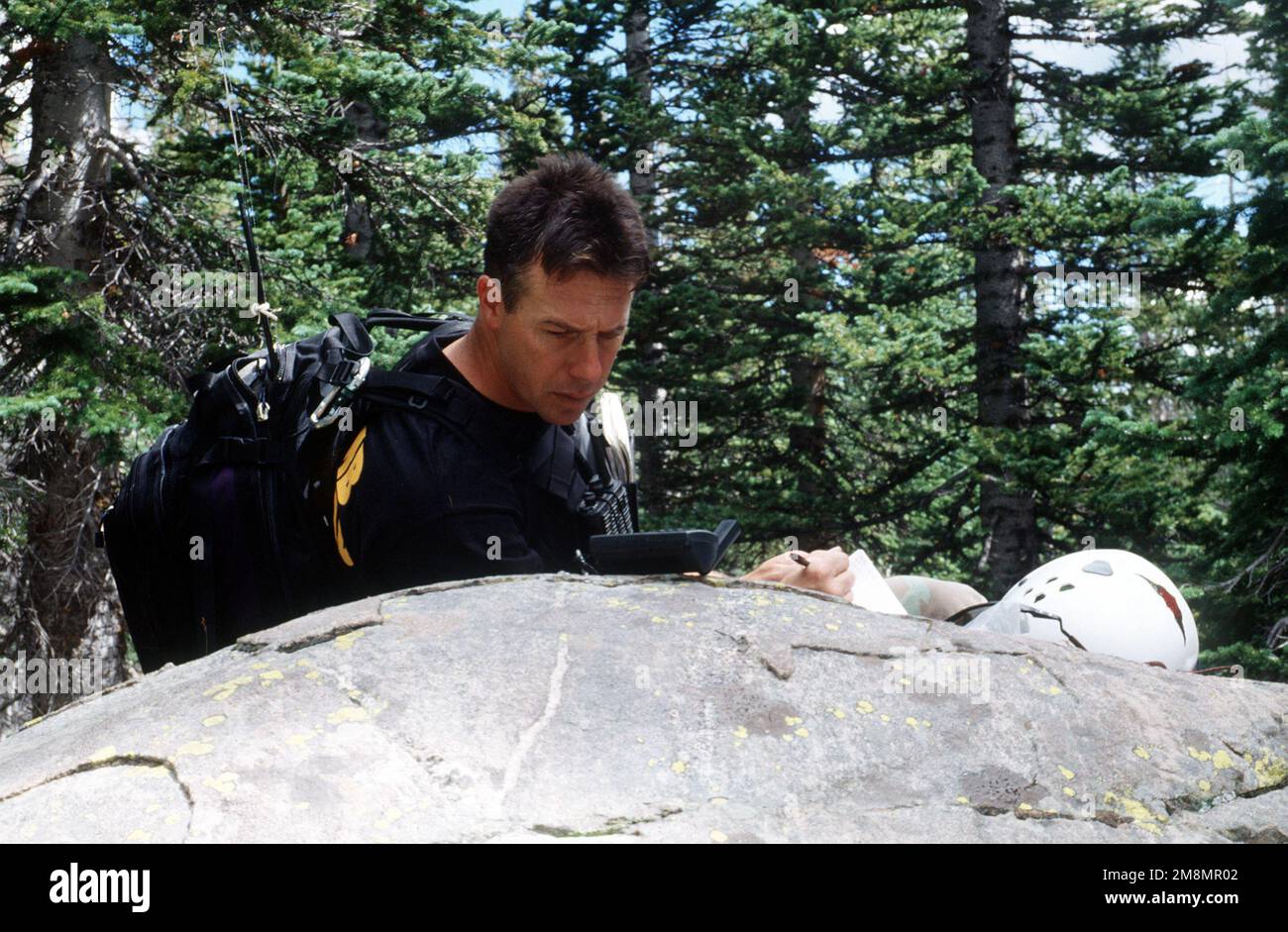 MSGT Eric Wass (left), an Explosive Ordnance Disposal member, gets a ...