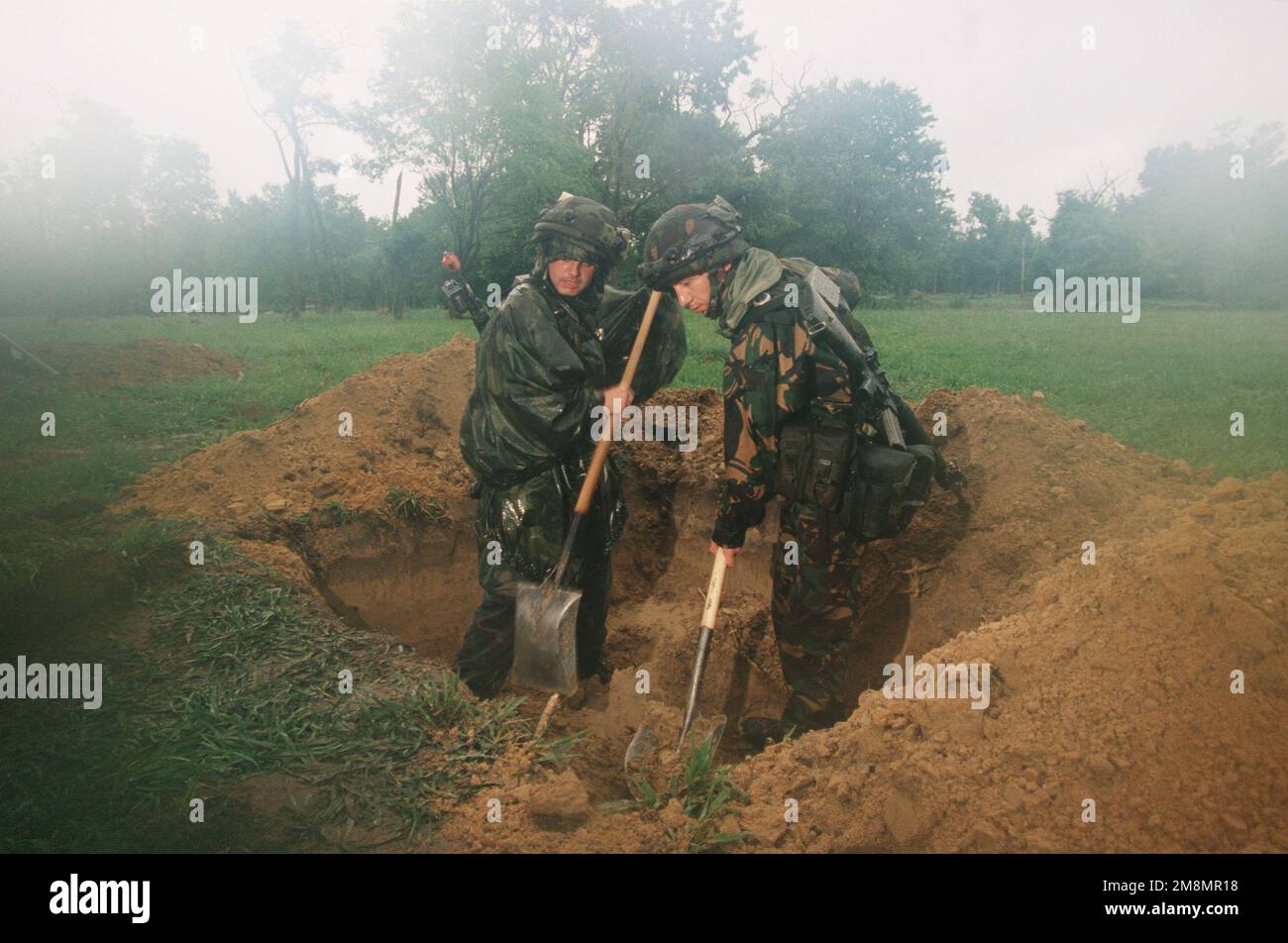 Team members are building fighting positions to protect their command ...
