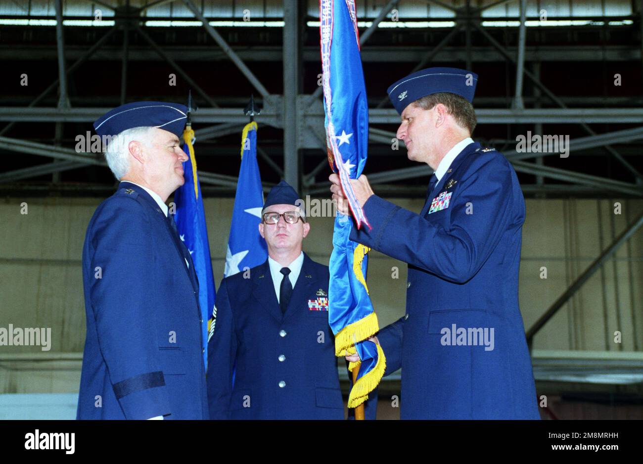 COL Gregory L. Trebon (right) receives the 24th Wing flag from LGEN ...