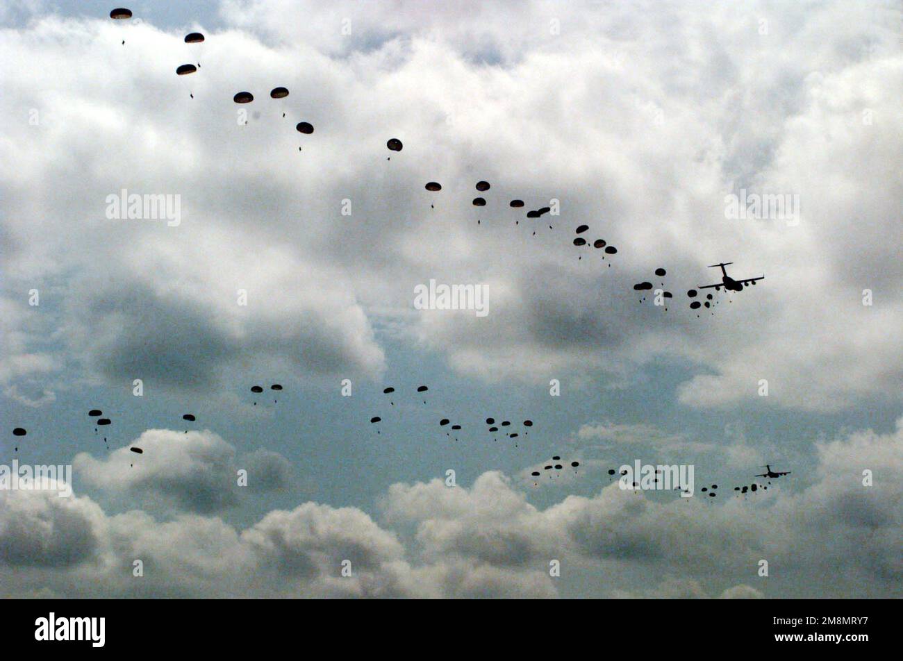 The sky is filled with parachutes after soldiers from the U.S. Army's ...