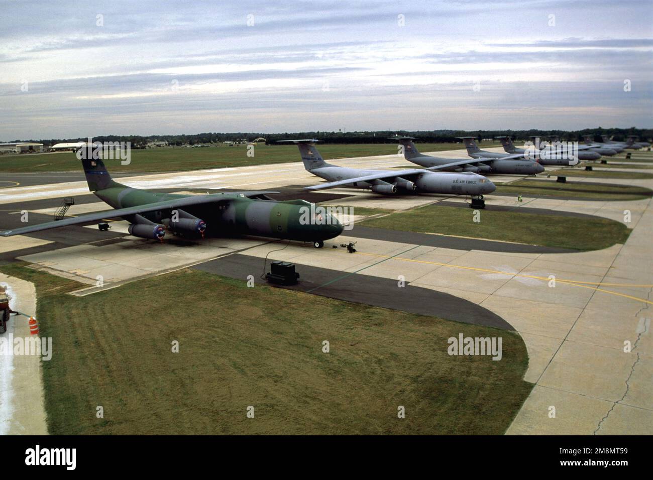 A row of USAF C-141 Starlifter aircraft from the 305TH and 514TH Air ...