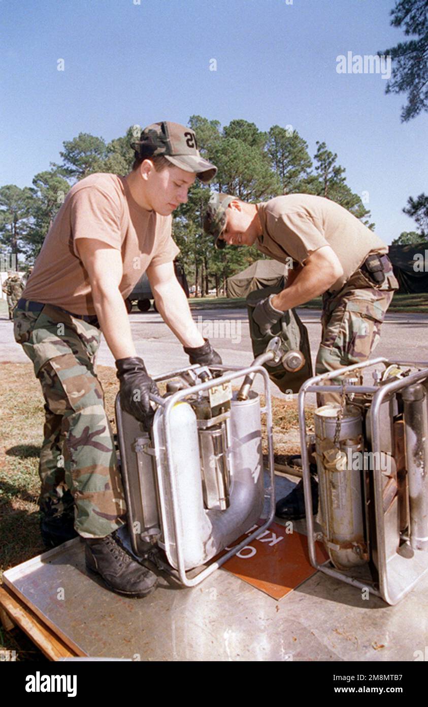 Two members of the 4th Services Squadron, 4th Fighter Wing, put fuel ...