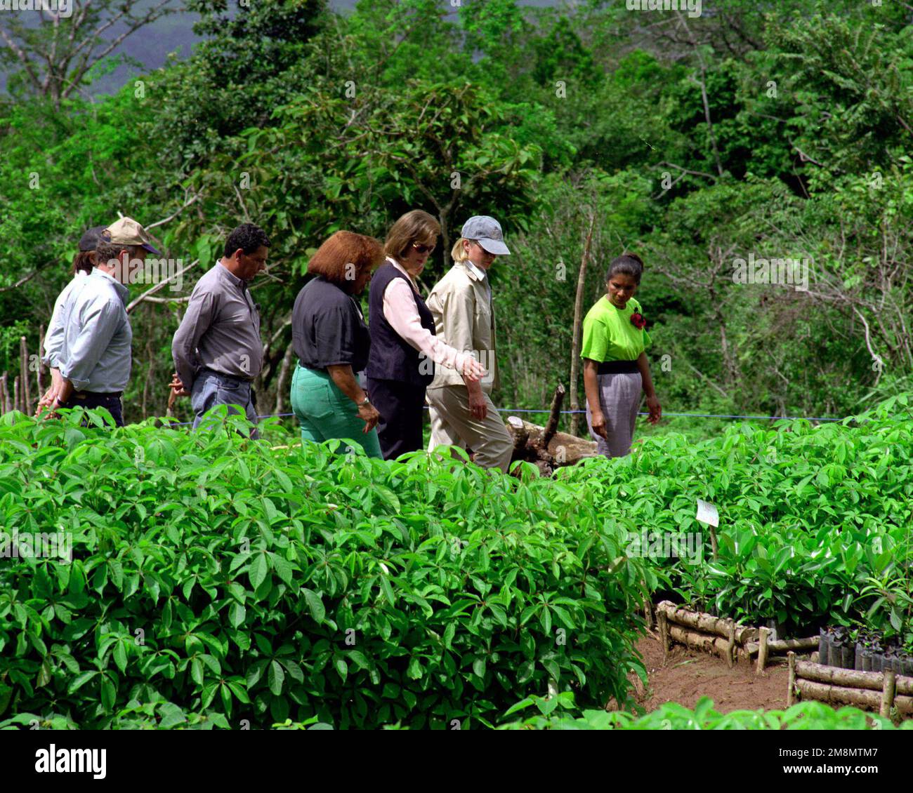 Mrs. Hillary Rodham-Clinton looks on as Mrs. Dora Boyd de Perez ...