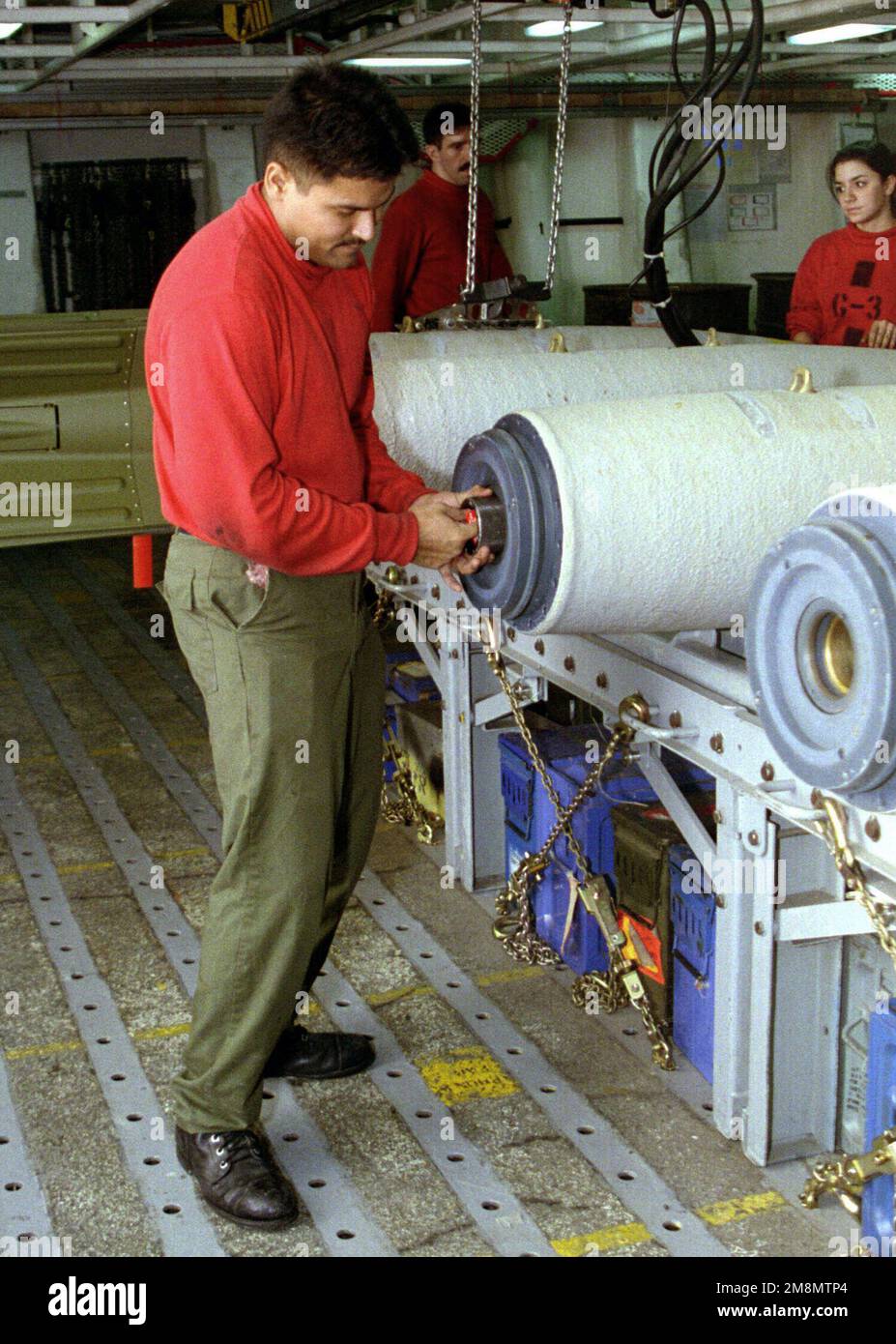 Aviation Ordnanceman 1ST Class Sean Myers installs the tail fuse into a ...