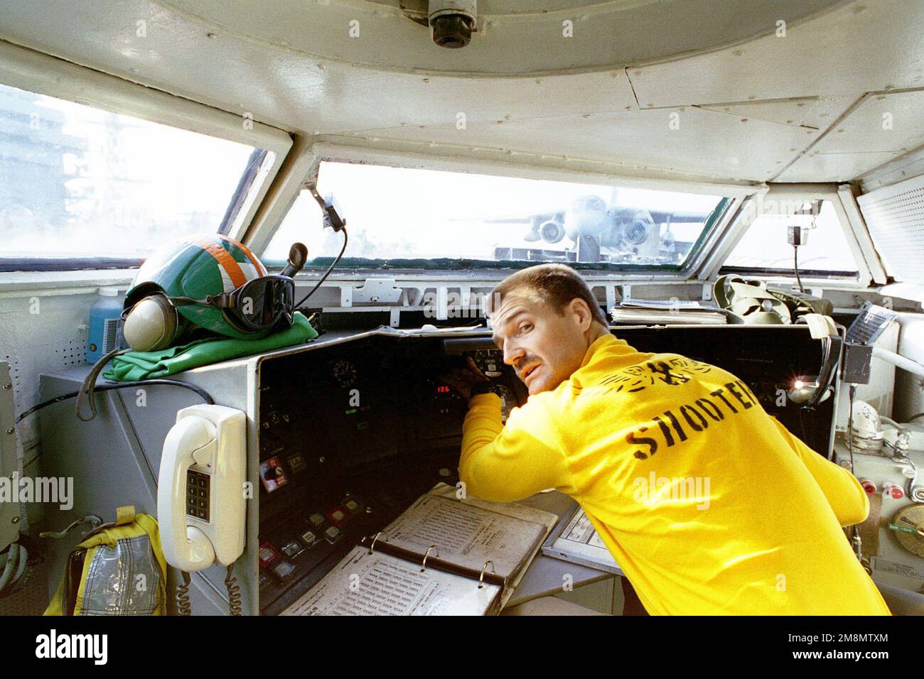 In the Integrated Catapult Control Station (ICCS). US Navy Lieutenant ...