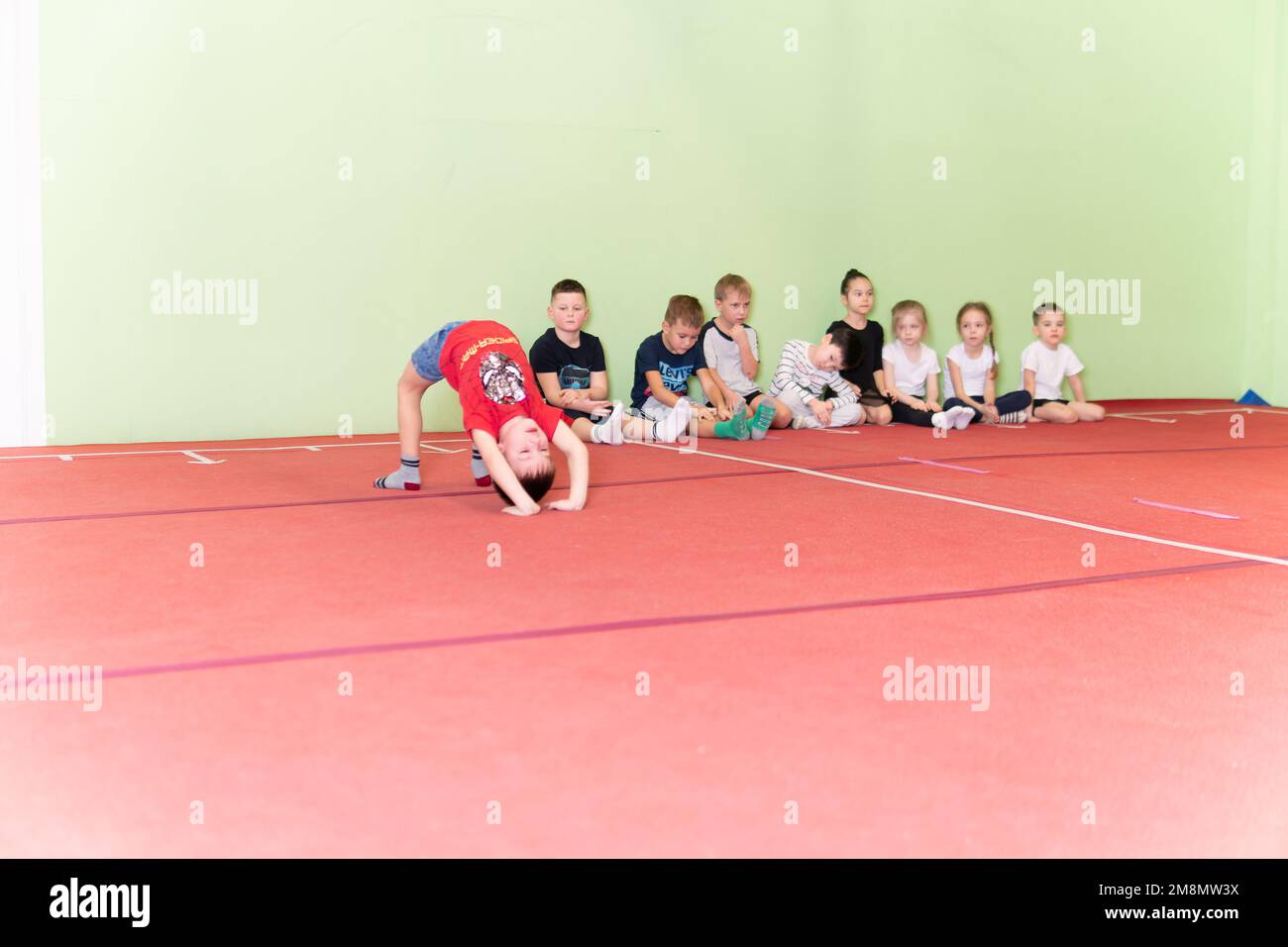 MOSCOW, RUSSIA-DEC 18, 2022: childhood boy lifestyle floor sport pose ...