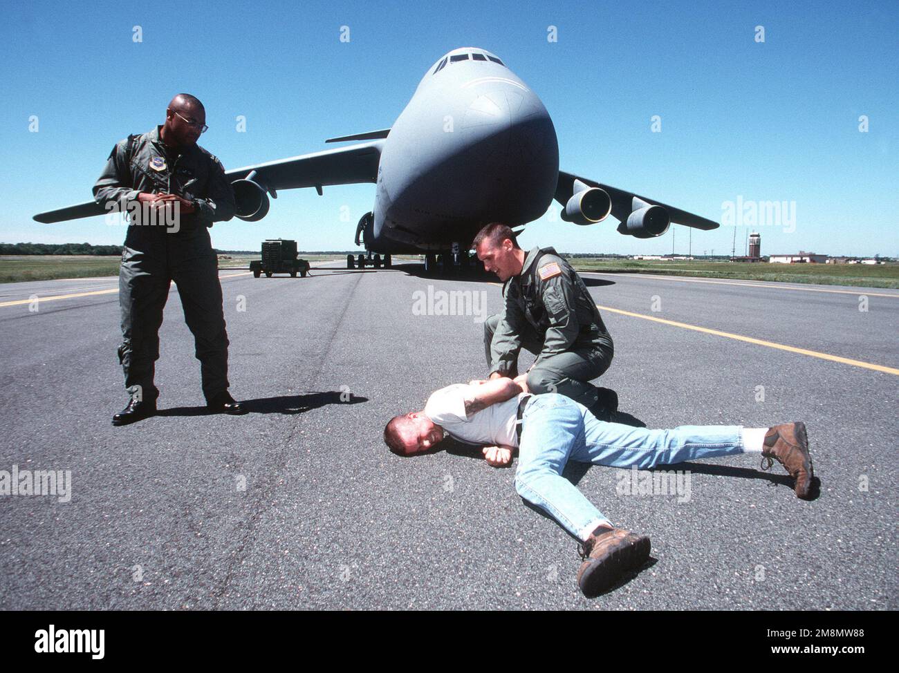 Raven instructor STAFF SGT. James Warrick demonstrates an arm lock as ...