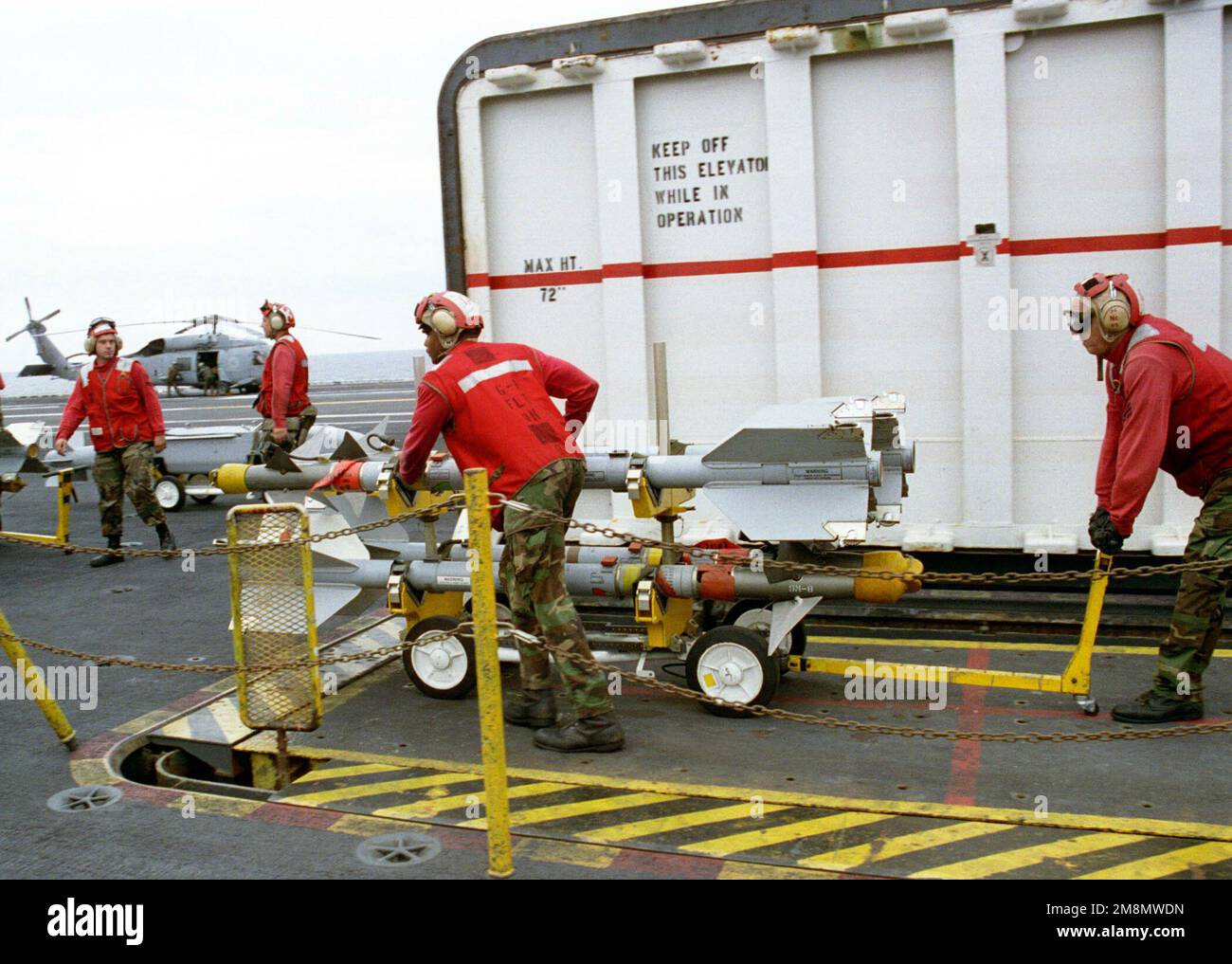 Personnel from G-1 division weapons department bring munitions to the ...