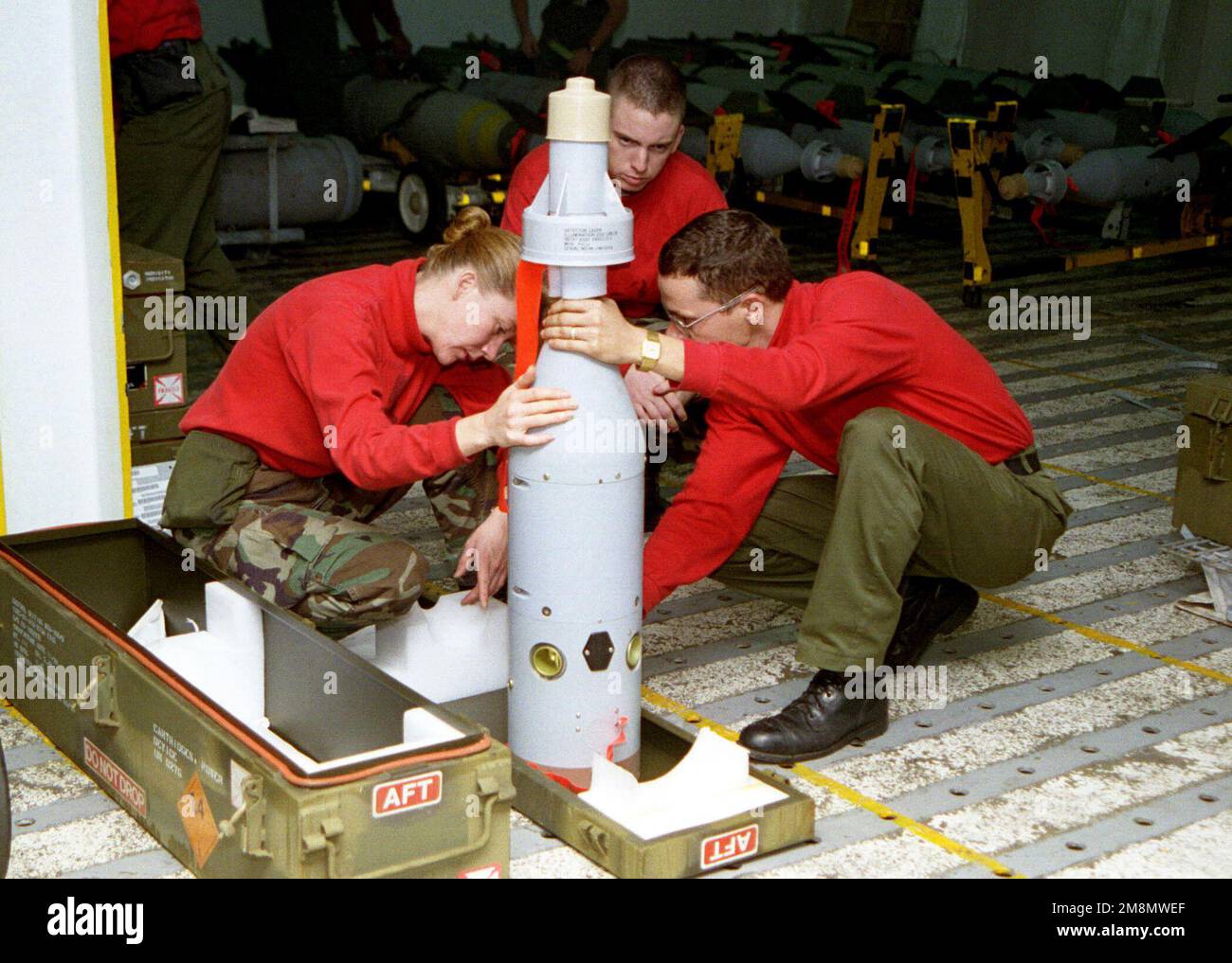 (Left to Right) Aviation Ordnanceman 2nd Class Kathy Higingbotham ...