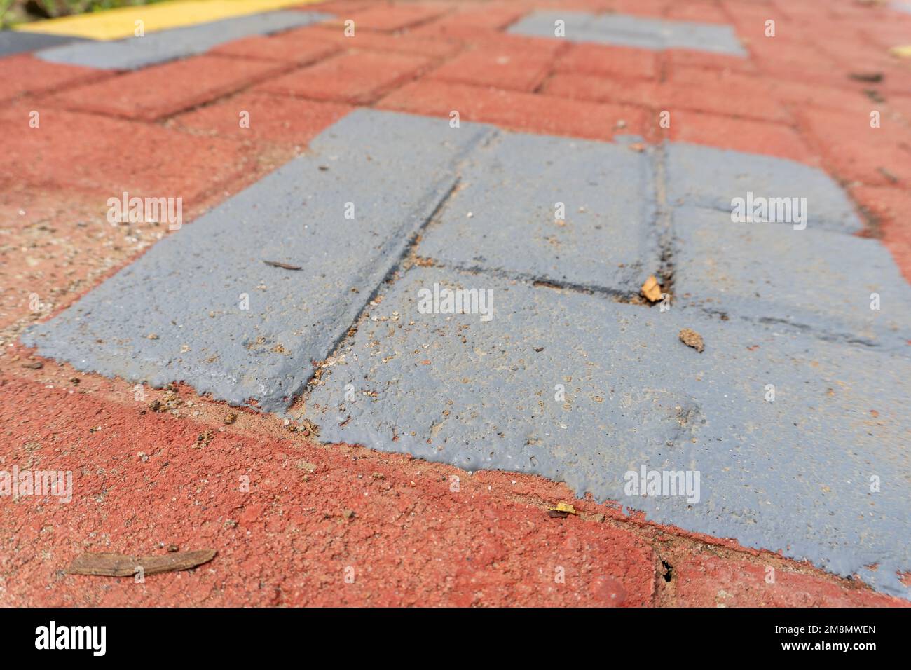 Orange colored paving block bricks path in the park close up Stock ...