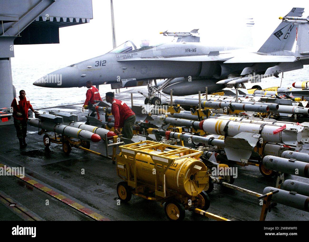 Ordnancemen assigned to the weapons department aboard USS NIMITZ (CVN ...