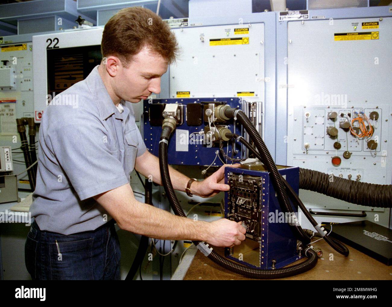 Aviation Electronics Technician AIRMAN Andrew Davies uses an automated ...