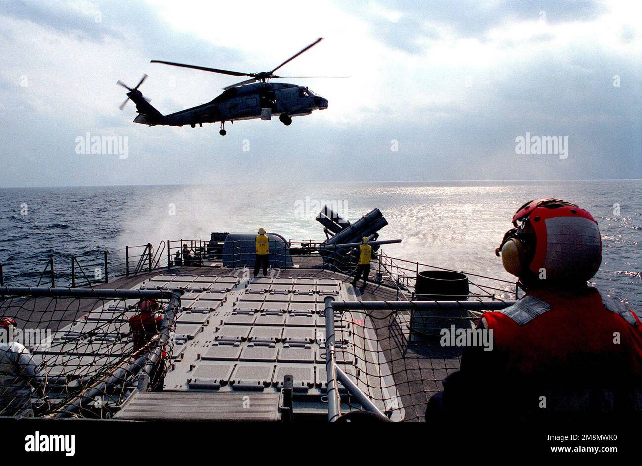 A flight deck crew aboard the guided missile cruiser USS LAKE CHAMPLAIN ...