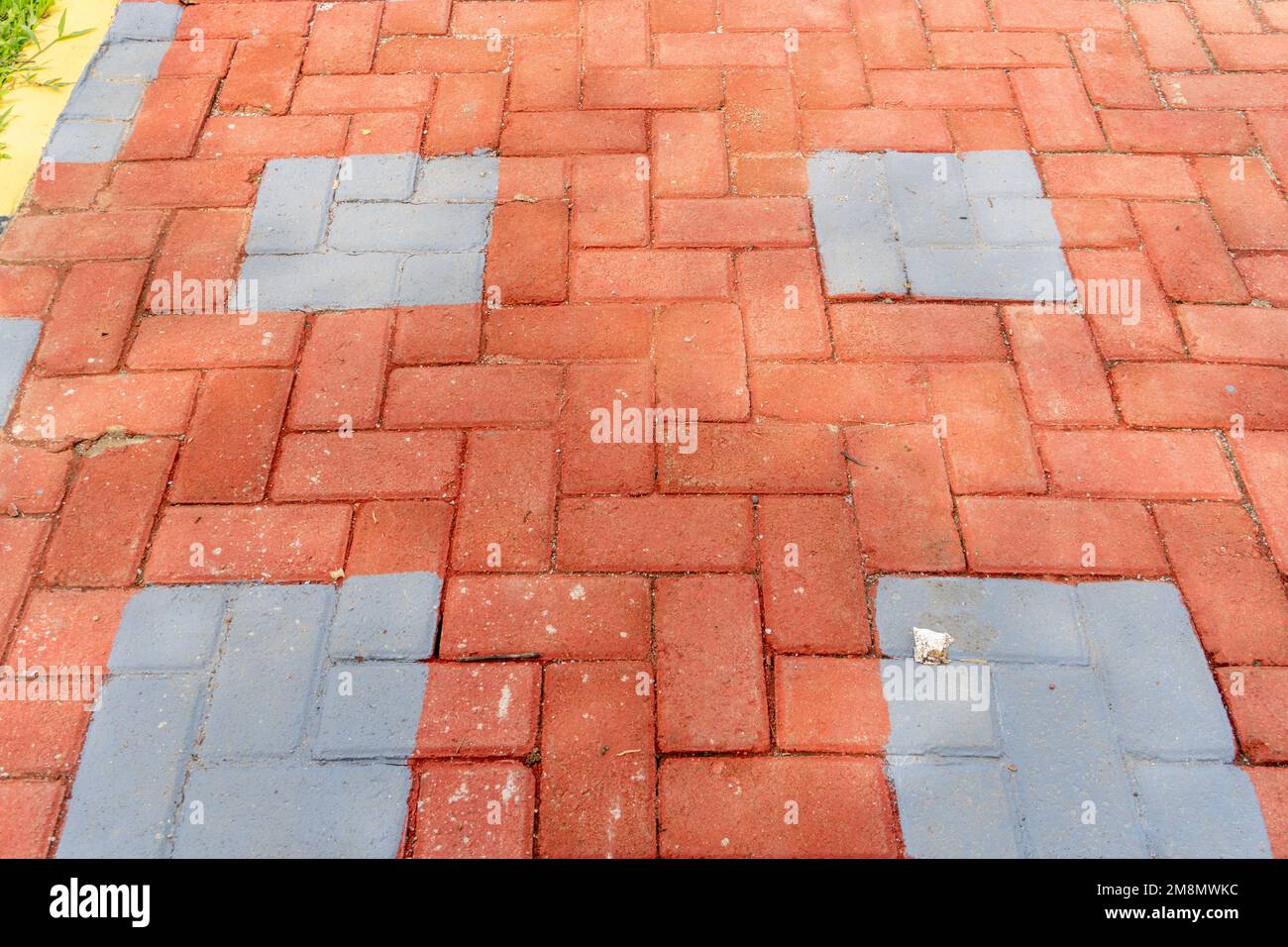Orange colored paving block bricks path in the park close up Stock ...