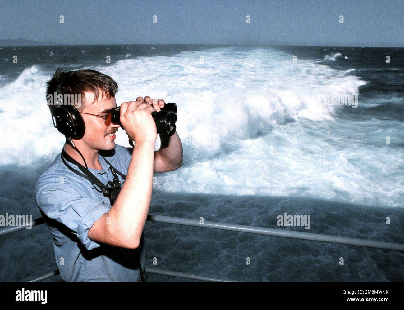 SEAMAN Apprentice Calvin Mclaughlin stands a man overboard watch on the fantail of USS GEORGE ...