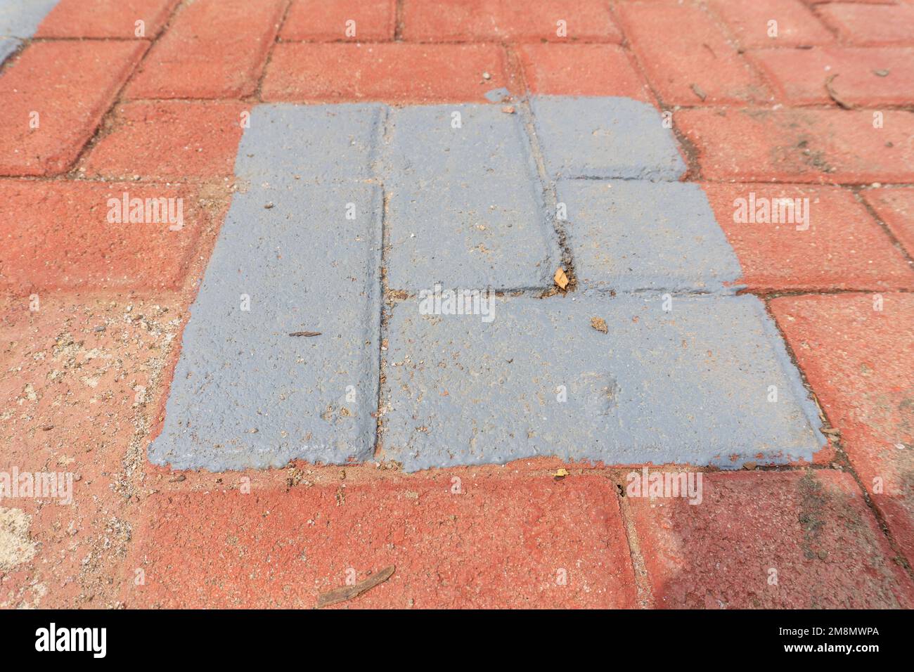 Orange colored paving block bricks path in the park close up Stock ...