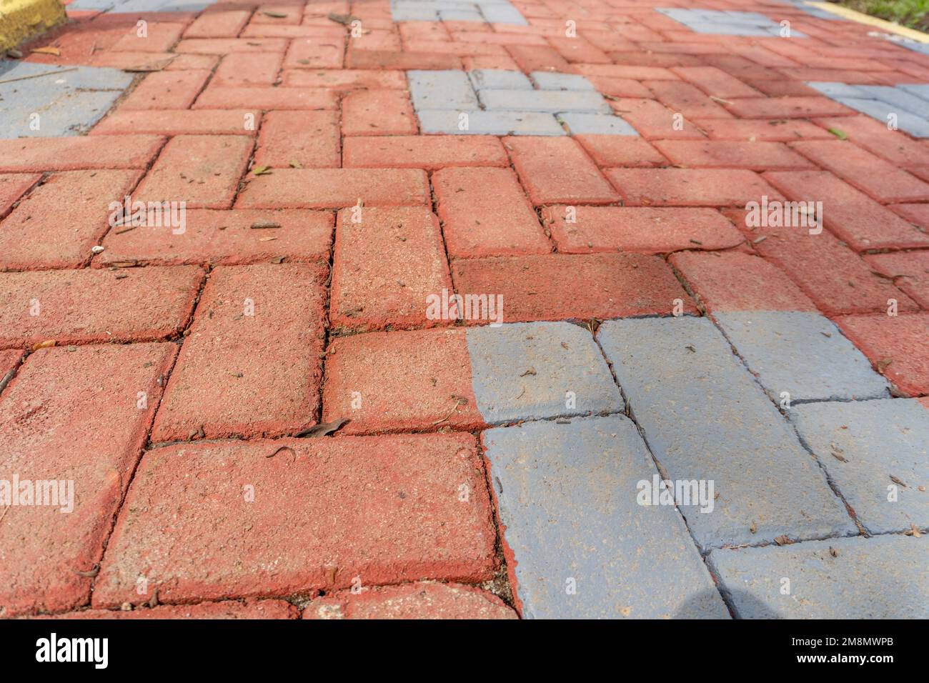 Orange colored paving block bricks path in the park close up Stock ...