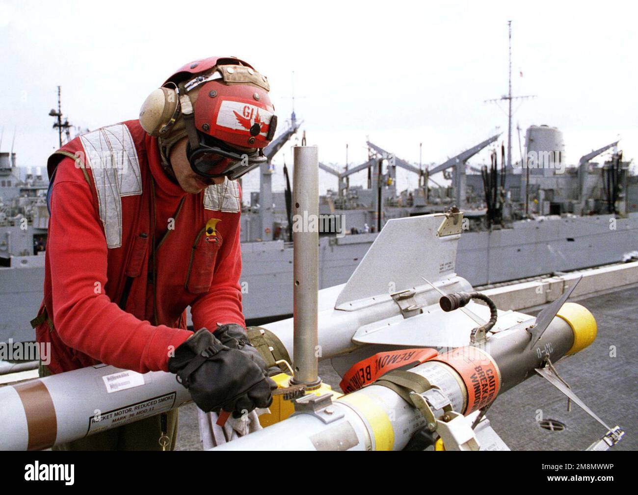 Aviation Ordnanceman 3rd Class Wayne Menendez performs corrosion ...