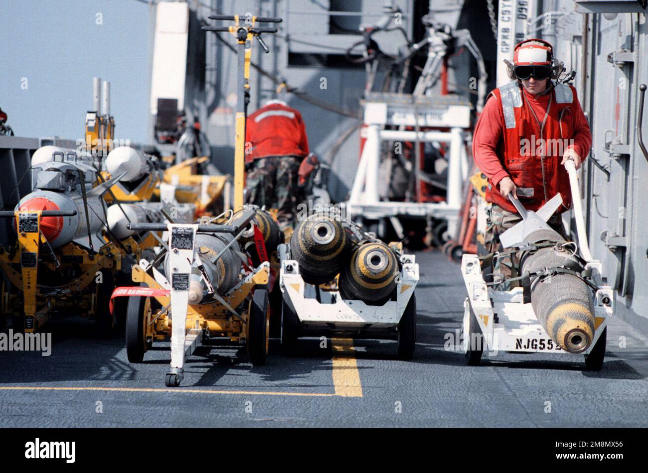 Aviation Ordnanceman 3rd Class David Dinardi pre-positions a MK-82 500 ...