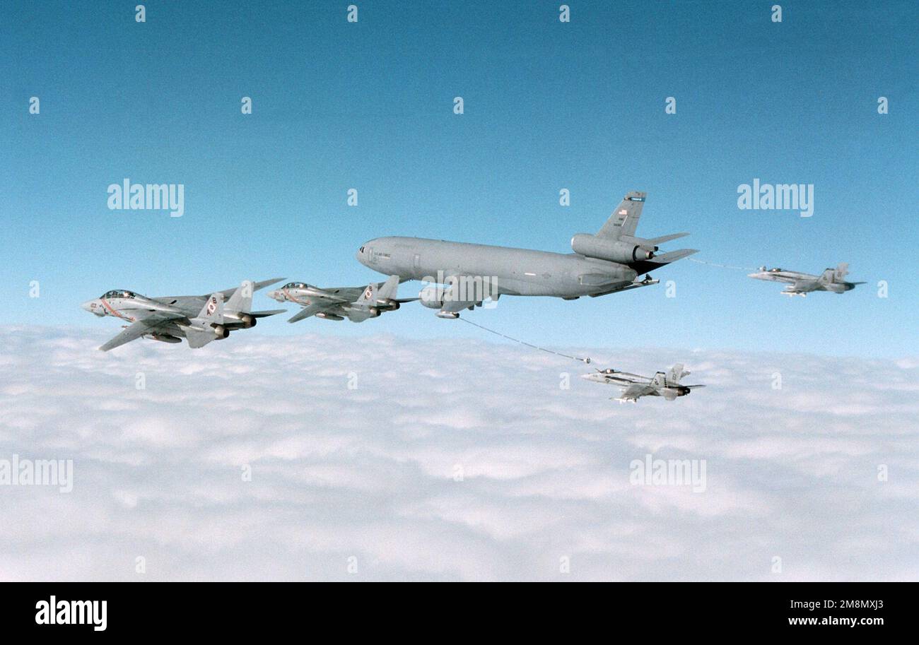 Two F-14B Tomcats (left) and two F/A-18C Hornets (lower right ...