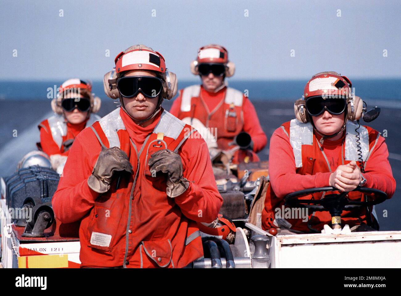 Aviation Boatswains Mate Third Class Hector Arroyo (center left) leads ...