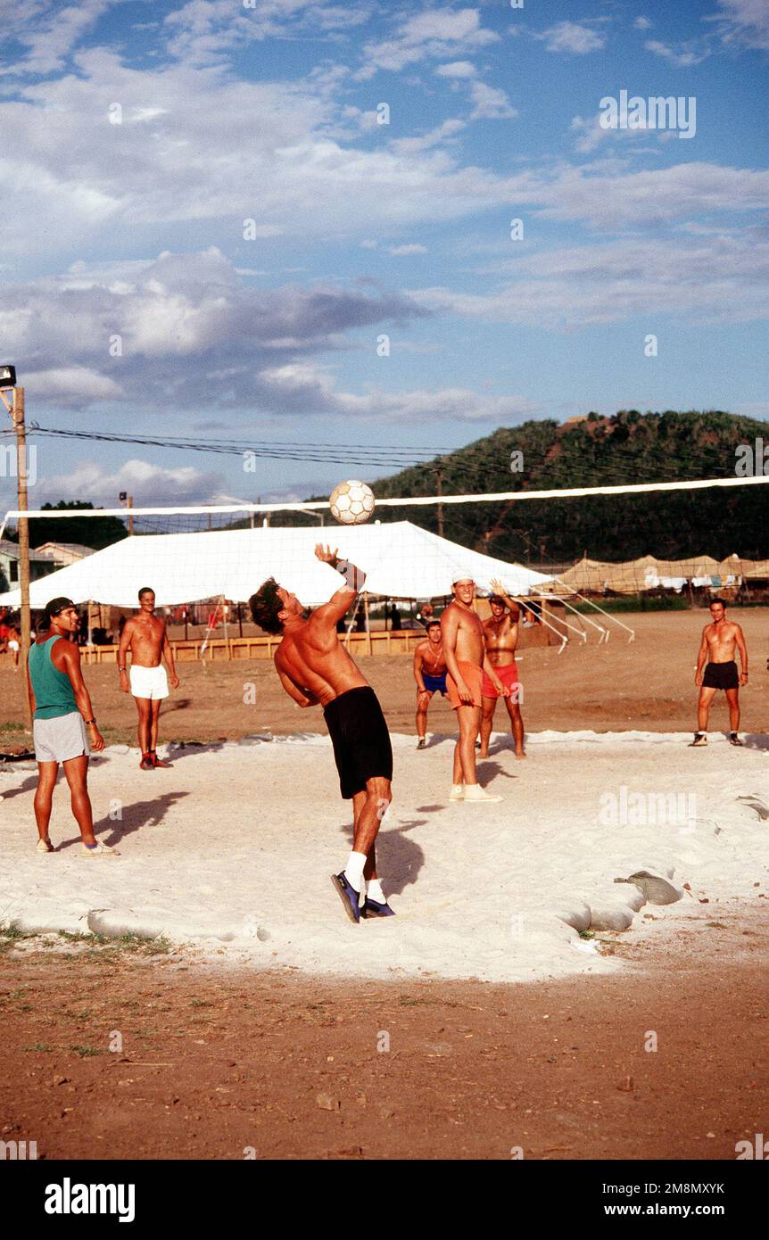 Cubans entertain themselves by playing volleyball. The camp also known ...