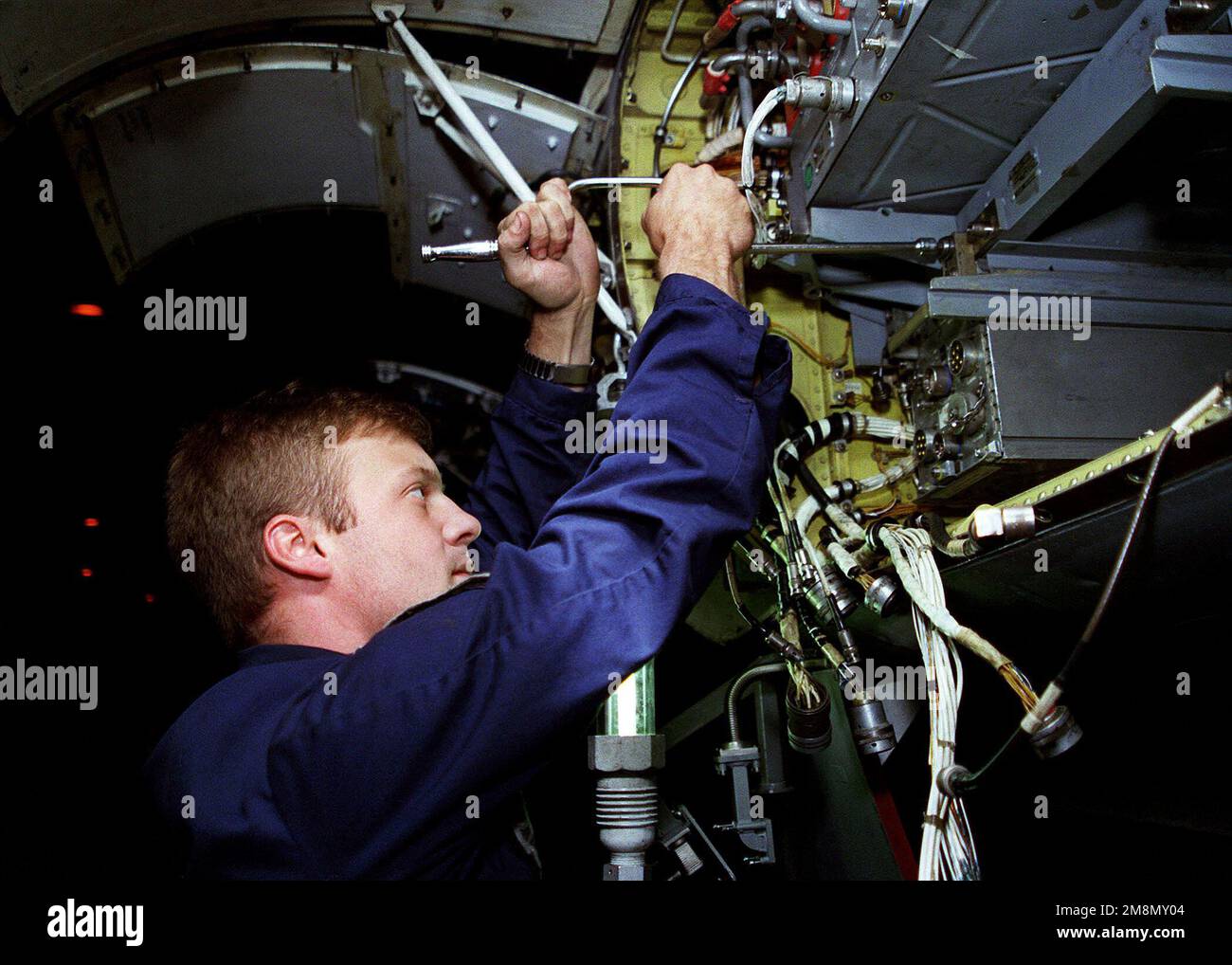 Aviation Electronics Technician 3rd Class Chrs Maze installs a radar ...