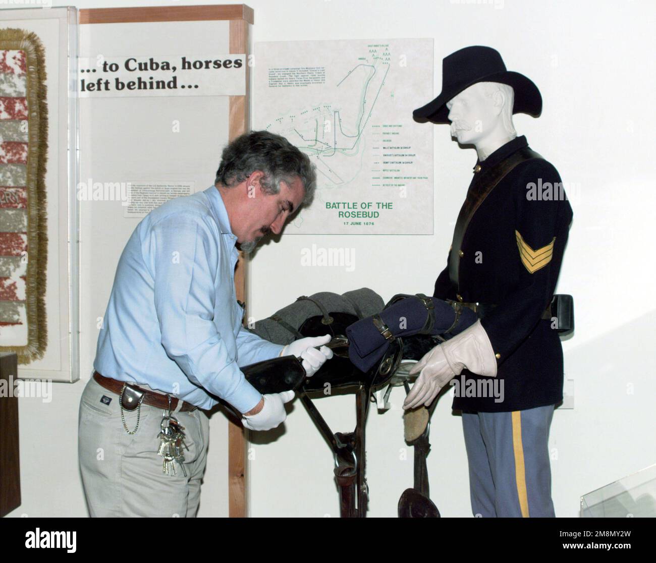 Paul Martin, Director of the 3rd Cavalry Museum, adjusts the the ...