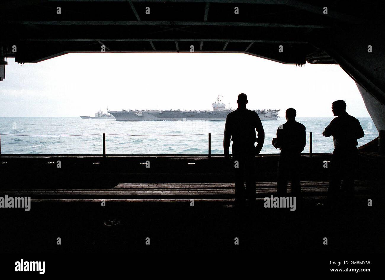 US Navy Crewmen aboard the nuclear powered aircraft carrier USS GEORGE ...