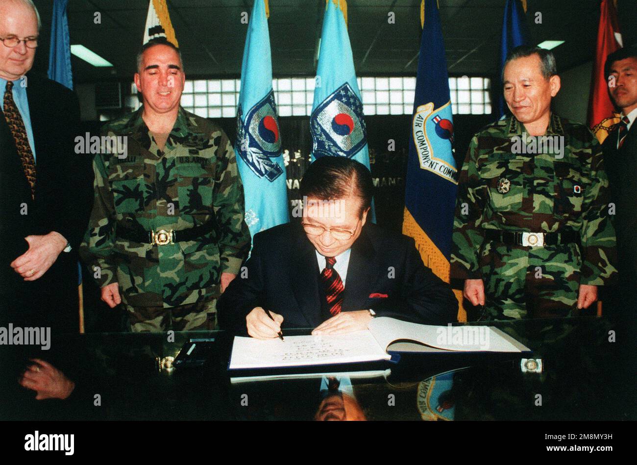 Newly elected South Korean President Kim Young Sam signs the guest book ...