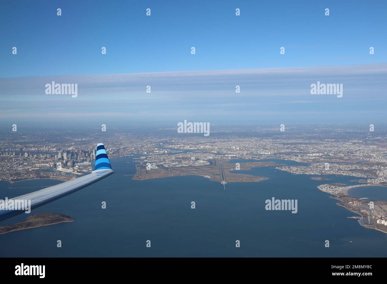 View from airplane window - airplane wing over harbor Stock Photo - Alamy