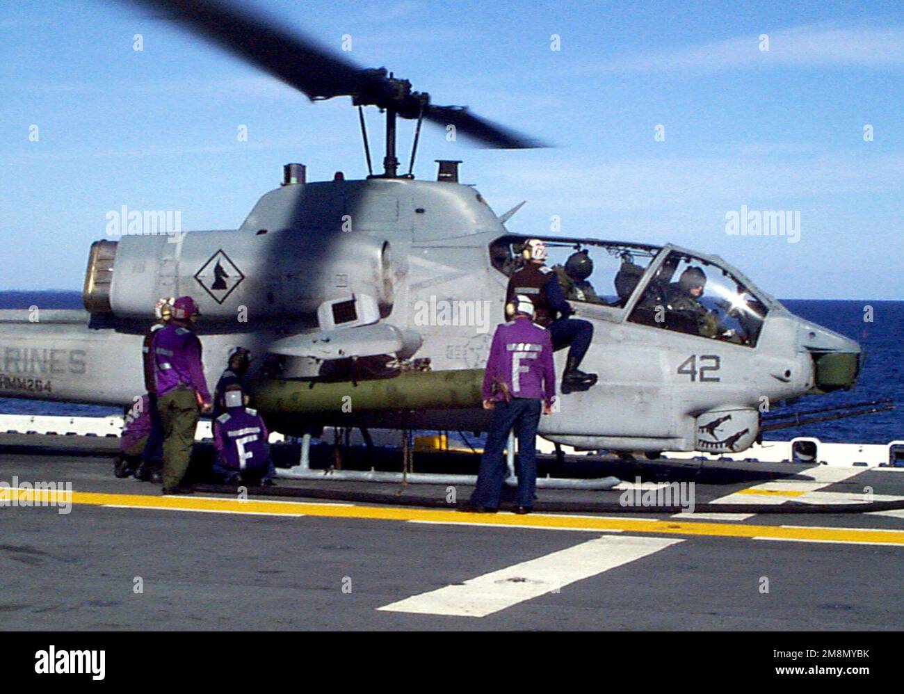 Crew members aboard the amphibious assault ship USS WASP (LHD 1) refuel ...