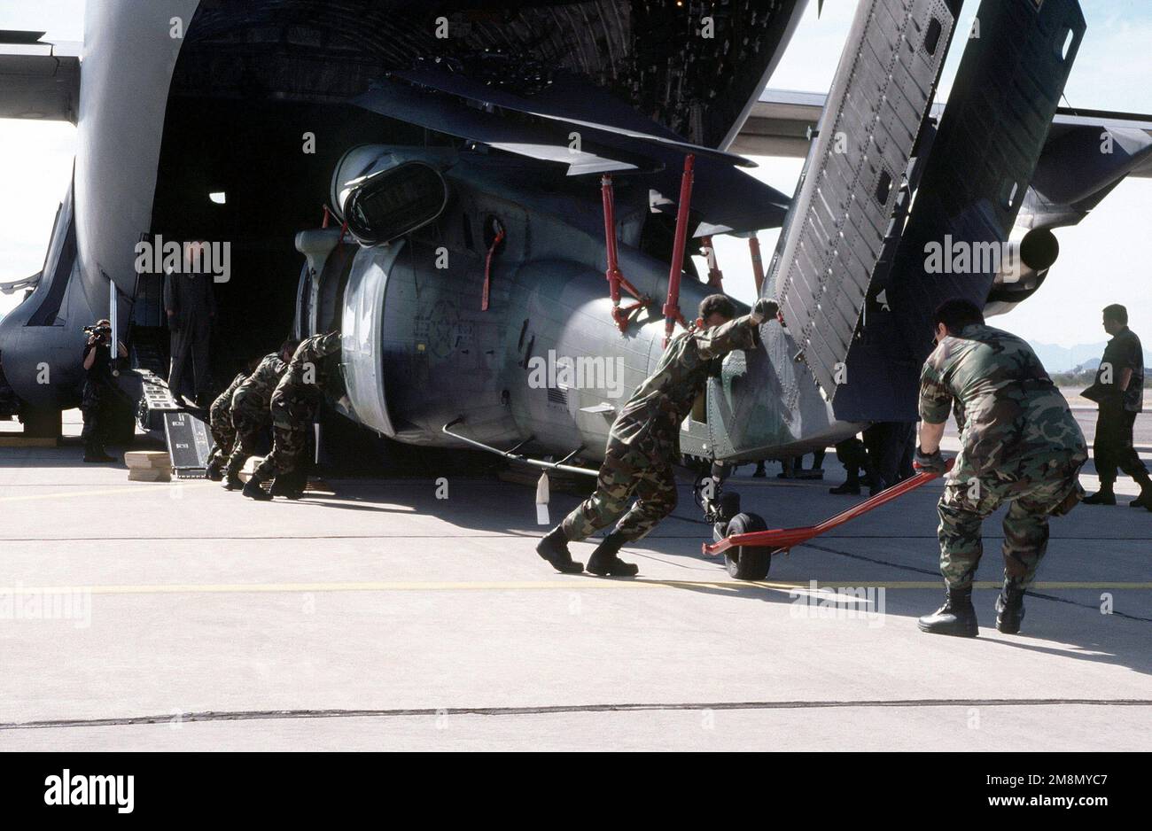 After successfully loading two MH-60G Pave Hawk helicopters, aircrew ...