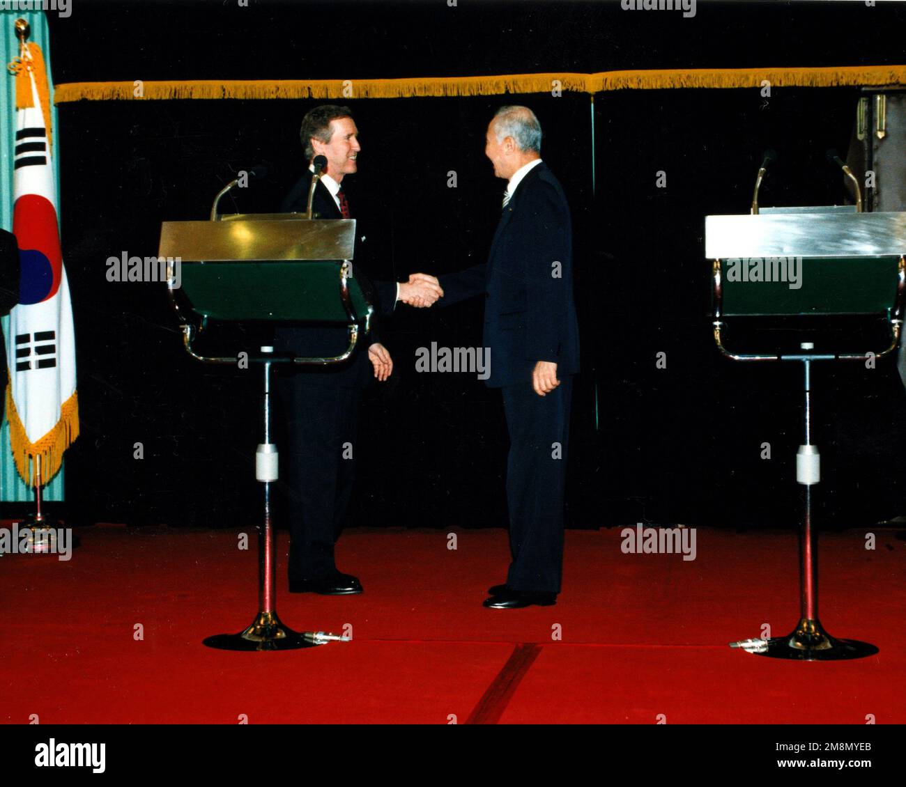The Honorable William Cohen, Secretary of Defense, shakes hands with ...