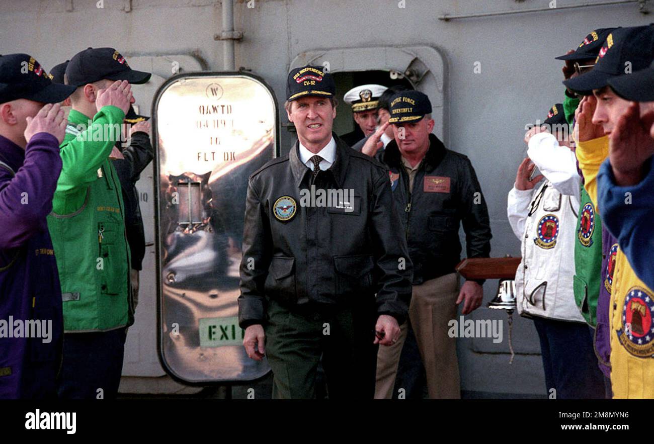 Crew members aboard the aircraft carrier USS INDEPENDENCE (CV 62) honor ...