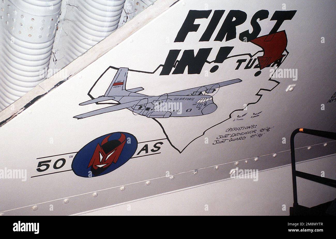 A mural displays what the 50th Airlift Squadron out of Little Rock Air ...